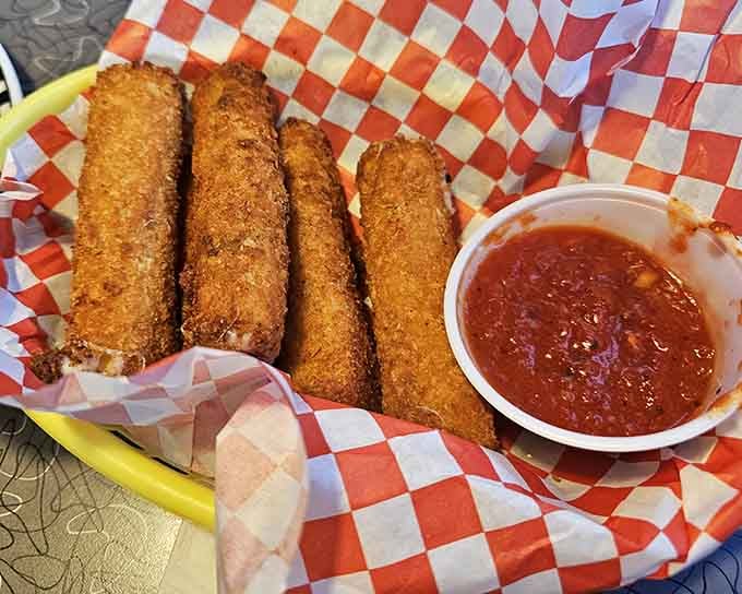 Golden-fried cheese sticks with marinara sauce: the kind of appetizer that makes everyone at the table happy.