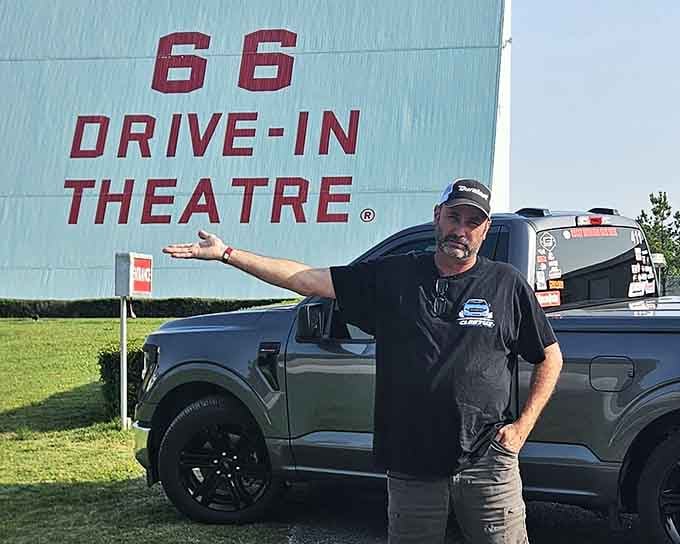 Pure joy radiates from this visitor who understands that some experiences are worth celebrating with arms wide open.