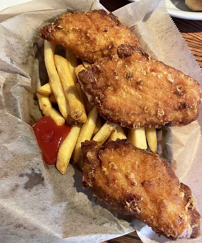 Golden fish and chips deliver that crispy, flaky perfection that makes you understand why Britain conquered half the world.