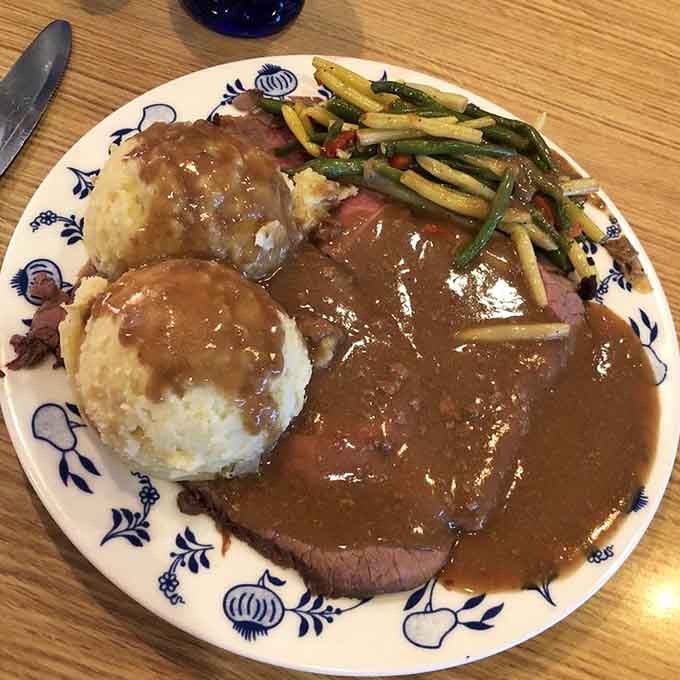 Roast beef dinner arrives with all the fixings, proving this place handles hearty meals with serious skill.