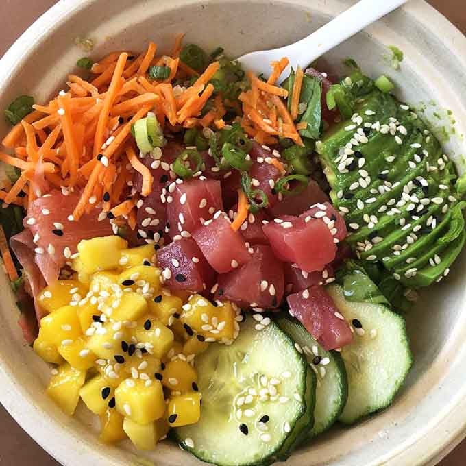 Rainbow vegetables and ruby-red tuna cubes arranged like an edible kaleidoscope that tastes even better than it looks.