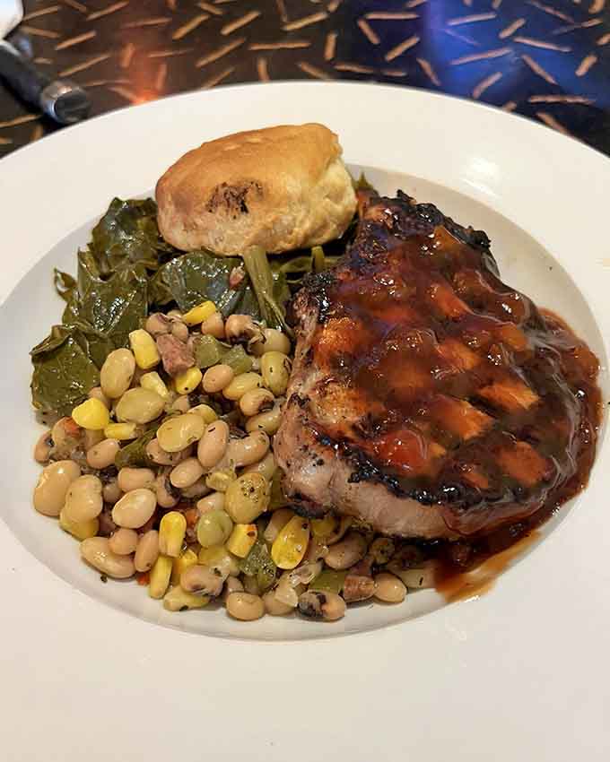 A perfectly glazed pork chop that looks like it just stepped off the cover of a food magazine.