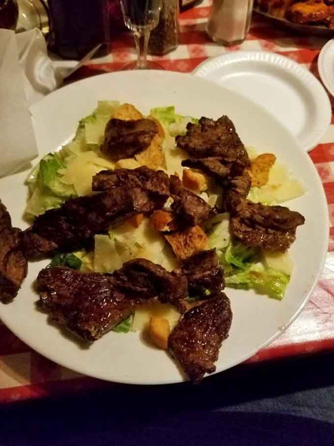 Tender steak strips cascading over crisp Caesar salad proves that sometimes having it all is absolutely possible.