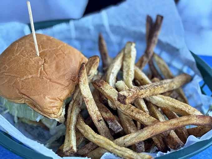 Golden fries stand at attention next to a burger that could make a vegetarian reconsider their life choices.