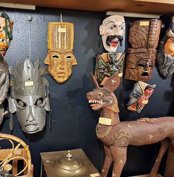 Cultural masks from around the globe stare down at you, each face telling stories from distant lands and traditions.