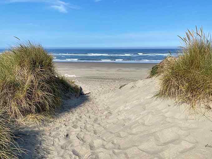 Sand dunes frame the perfect path to miles of pristine Oregon coastline, calling your name for exploration.
