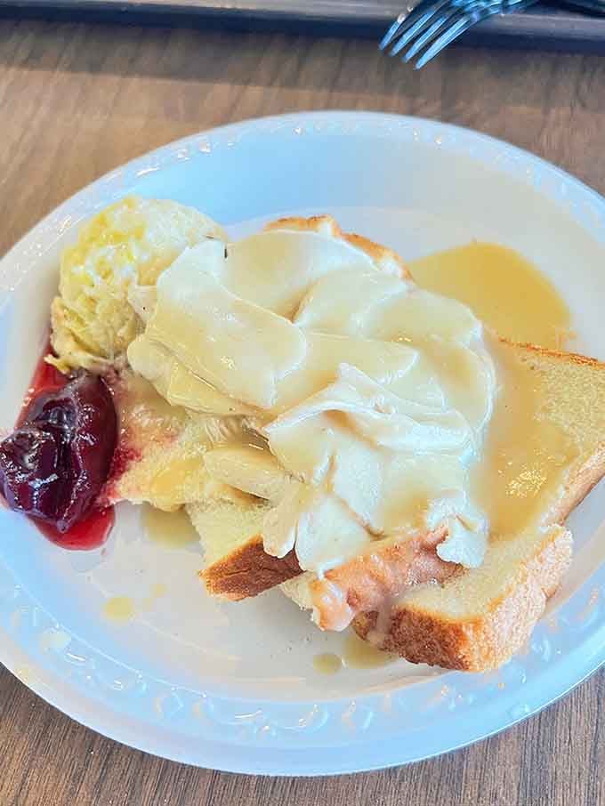 The open-faced turkey sandwich drowns gloriously in gravy, delivering comfort food that'll warm you from the inside out.