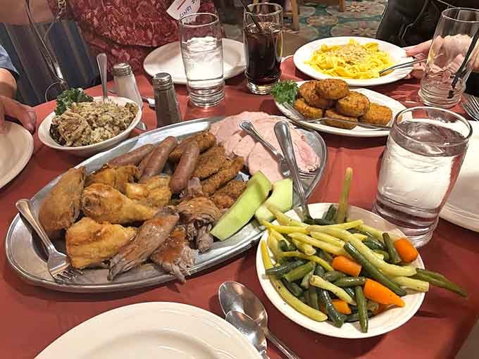 Family-style platters overflow with enough chicken, sides, and vegetables to feed your entire bowling league with leftovers.