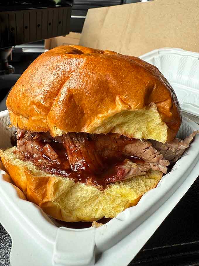 A bun can barely contain this much smoky, saucy, perfectly pulled pork perfection inside.