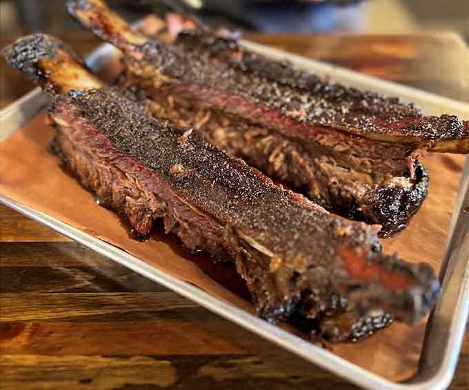 Beef ribs this size require both hands and a complete absence of shame, worth every messy moment.