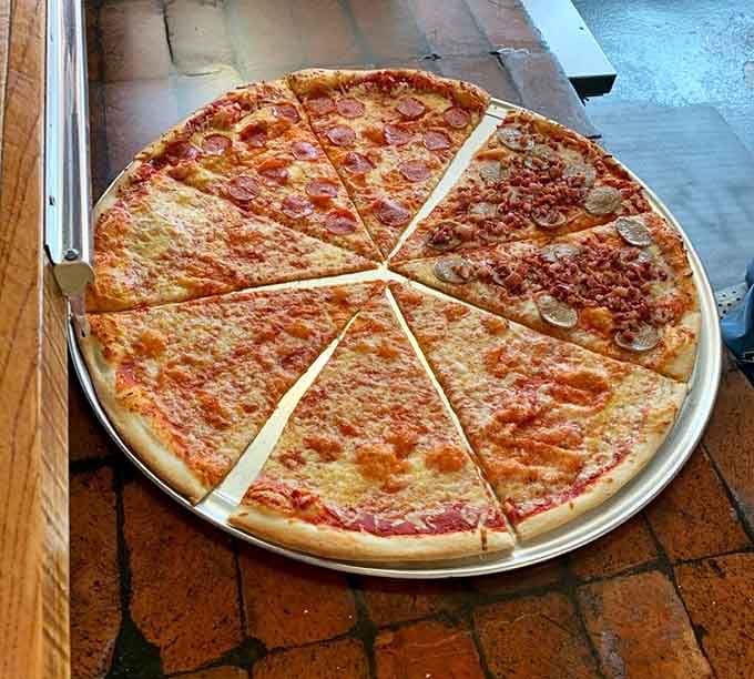 A 28-inch pizza cut into slices that make regular pizza look like it forgot to eat its vegetables.