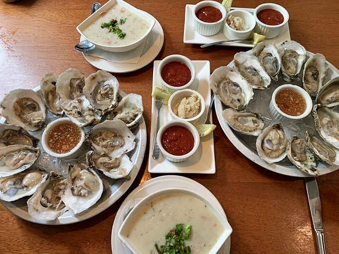 Fresh oysters on the half shell with multiple sauces, because variety is the spice of coastal life.