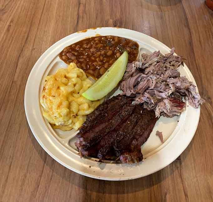 When brisket meets pulled pork with mac and cheese backup, magic happens on metal trays.
