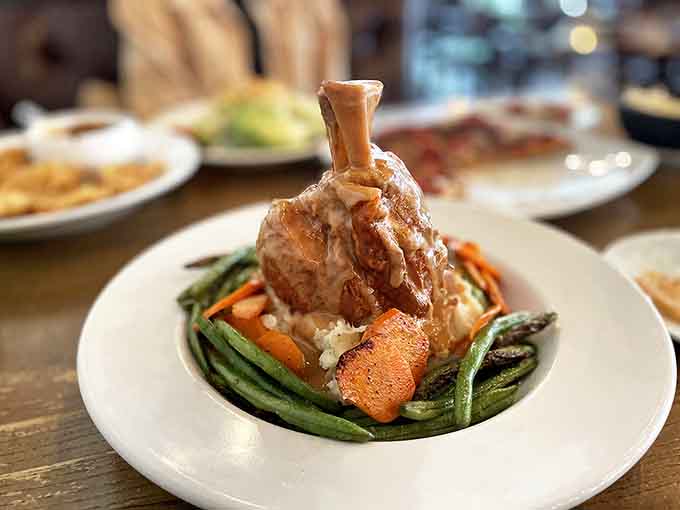 That Pork Osso Buco standing tall over vegetables is the kind of dish that makes you reconsider your dinner plans.
