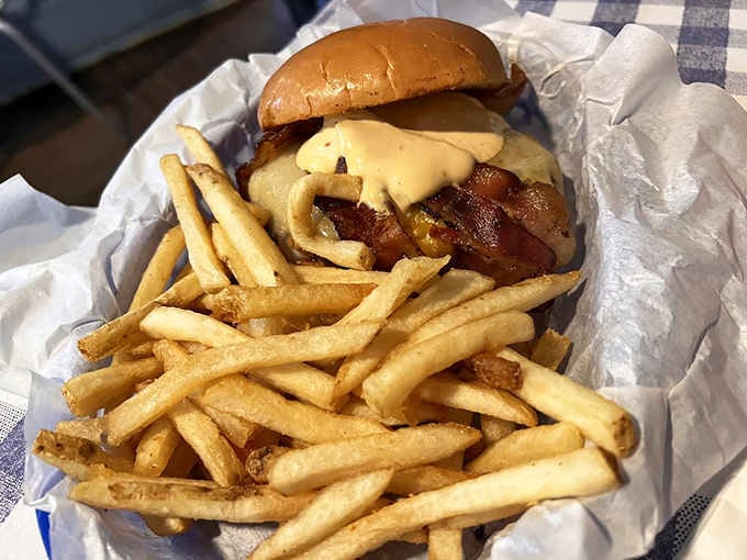Bacon, onion straws, and cheese create a tower of deliciousness that laughs in the face of reasonable portion sizes.