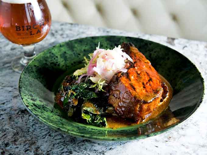 A grilled smoked pork chop that proves sometimes the simplest preparations yield the most spectacular results on your plate.