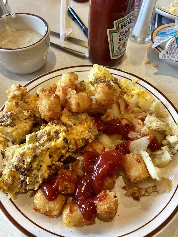 Tater tots with ketchup alongside stuffing and mac and cheese is the buffet strategy we all need.