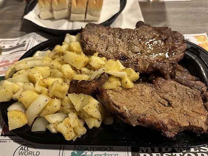 Rib eye steak served with waffle fries, because sometimes the simple combinations are the ones worth celebrating most.