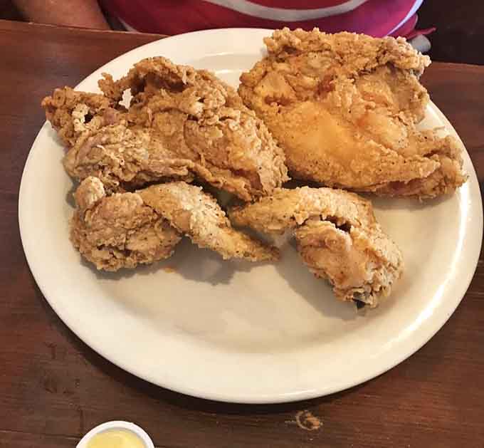 Fried chicken with that perfect golden crust makes you understand why this dish has inspired countless songs and family gatherings.