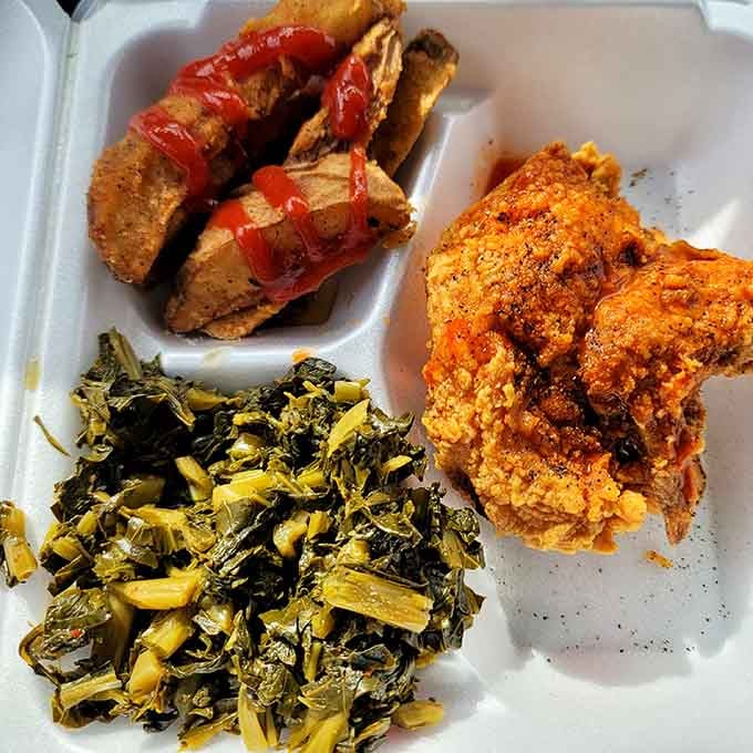 The holy trinity: crispy chicken, soul-warming greens, and potatoes that complete the picture perfectly.