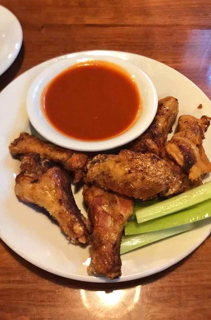 Crispy, saucy, and ready for their close-up, these wings don't mess around with portion size.