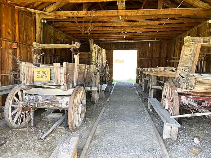 These old wagons and mining carts sit ready to haul ore that'll never be loaded, patient as the desert itself.