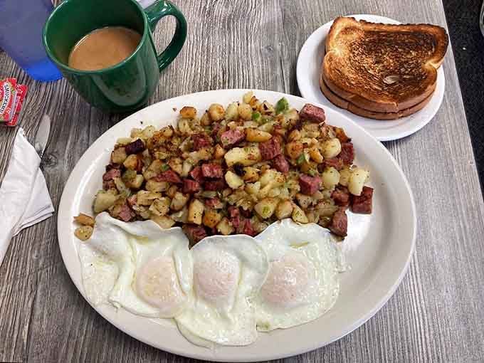 Corned beef hash piled so high it defies gravity and possibly several laws of physics too.