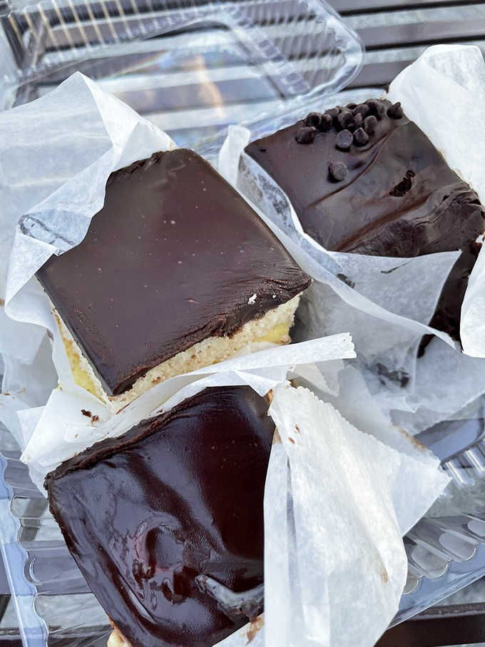 Those glossy chocolate tops shine like patent leather shoes at a Sunday dinner in Little Italy.