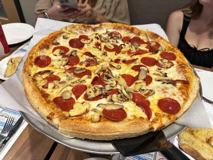 Thin crust pizza loaded with pepperoni and mushrooms delivers that satisfying New York-style experience we all secretly crave.