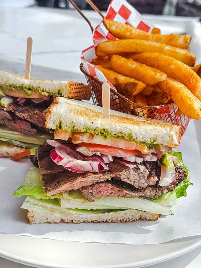 Steak, chimichurri, and sourdough create a sandwich tower that defies gravity and expectations.
