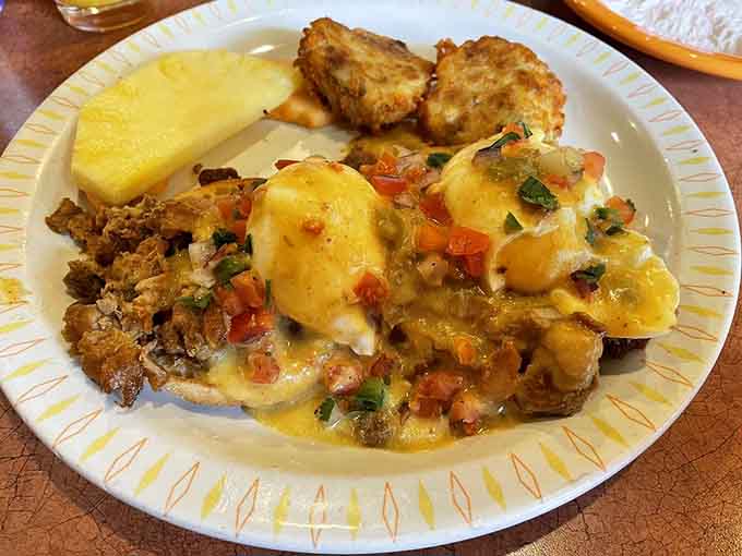 The Carnitas Benedict with its golden hollandaise is basically sunshine in edible form, and we're here for it.