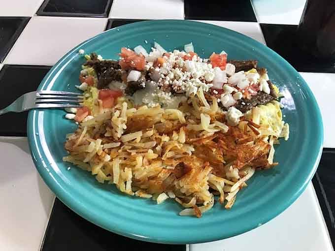 That gyro omelet topped with feta and tomatoes over hash browns is what happens when creativity meets hunger.