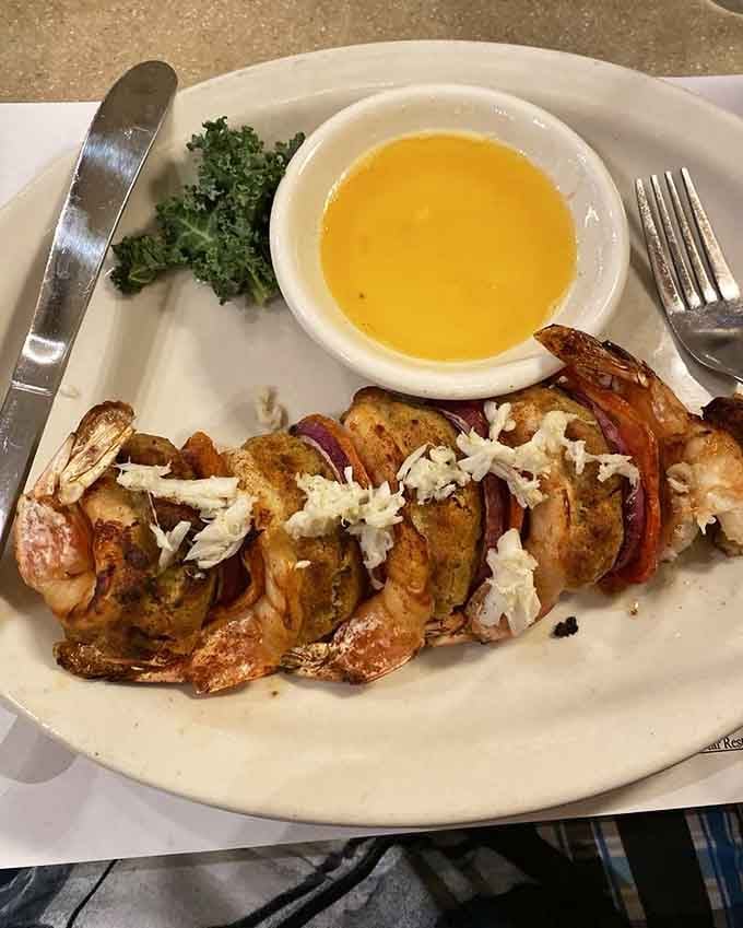 Jumbo shrimp stuffed with crabmeat dressing, because apparently regular shrimp just weren't living up to their full potential.