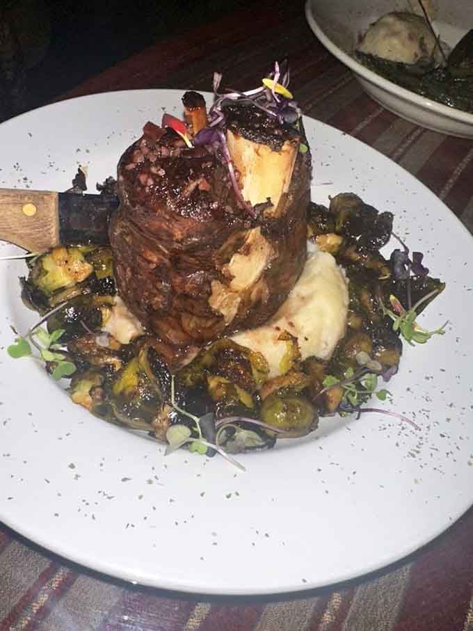 This osso buco sits like royalty on the plate, surrounded by its loyal subjects of vegetables and potatoes.