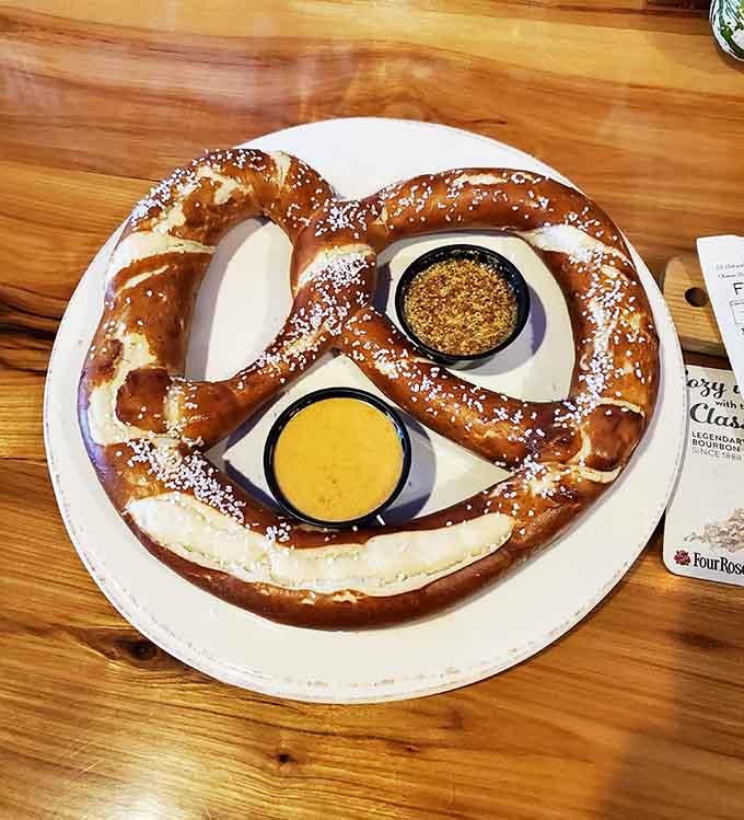 The Bavarian pretzel arrives looking like it bench-presses smaller pretzels in its spare time.