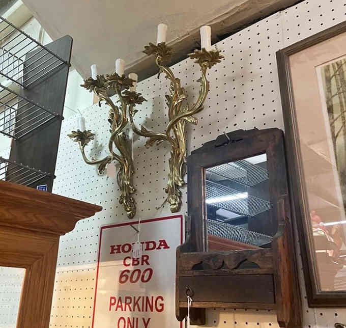 Those ornate brass sconces once lit someone's formal dining room, back when electricity was still considered fancy.