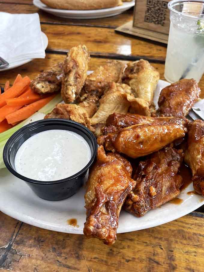 Wings so perfectly glazed they're practically glistening, with ranch standing by like a trusty sidekick from the old days.