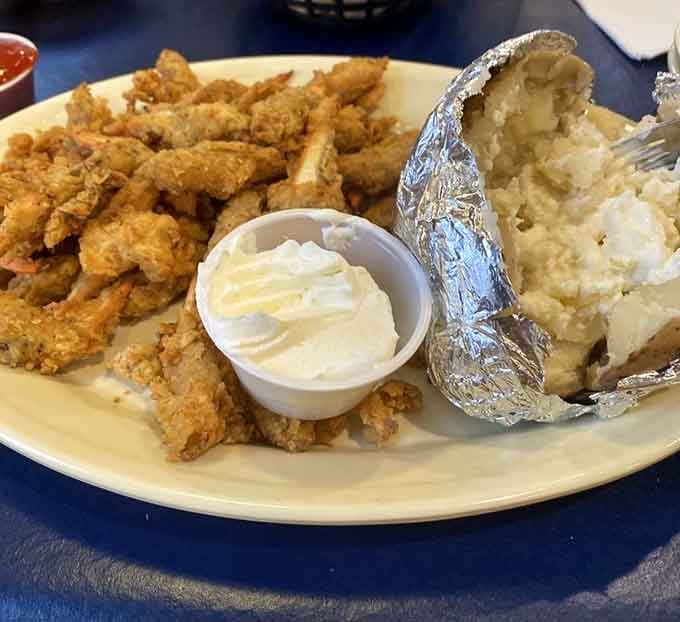 When your crab claw platter comes with a loaded baked potato, you know someone understands what "satisfying meal" really means.