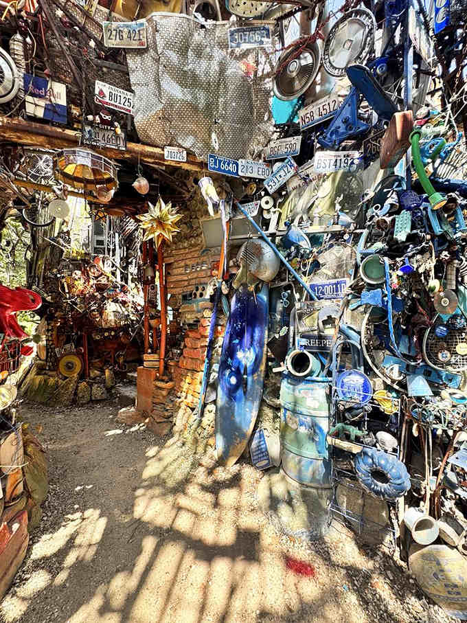 A symphony in blue: bottles, bikes, and forgotten treasures creating their own chromatic masterpiece.