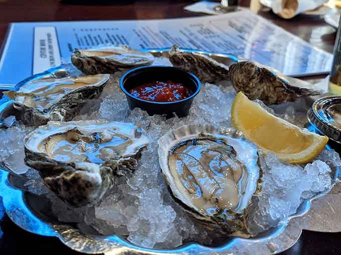 Raw oysters on the half shell, glistening on ice like edible treasures from the deep&mdash;briny, fresh, and absolutely divine.