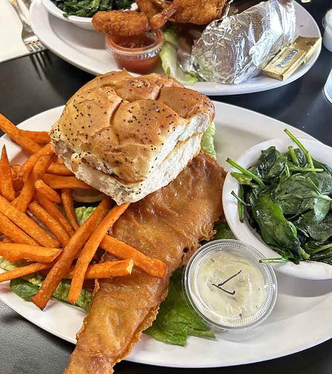 Golden fried fish with sweet potato fries, proving that comfort food doesn't need to apologize for anything.