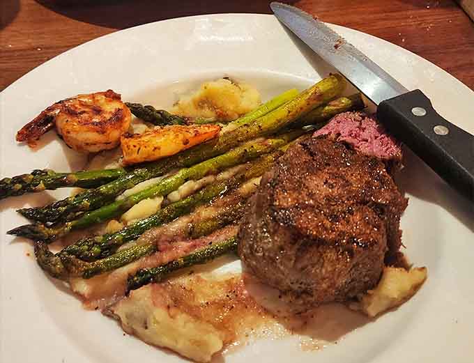 Surf meets turf in this beautiful plate featuring tender steak, succulent shrimp, and asparagus that actually looks appetizing for once.
