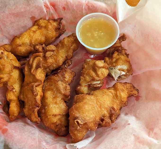 Beer-battered shrimp that looks like it just won the lottery and wants to share its good fortune with you.