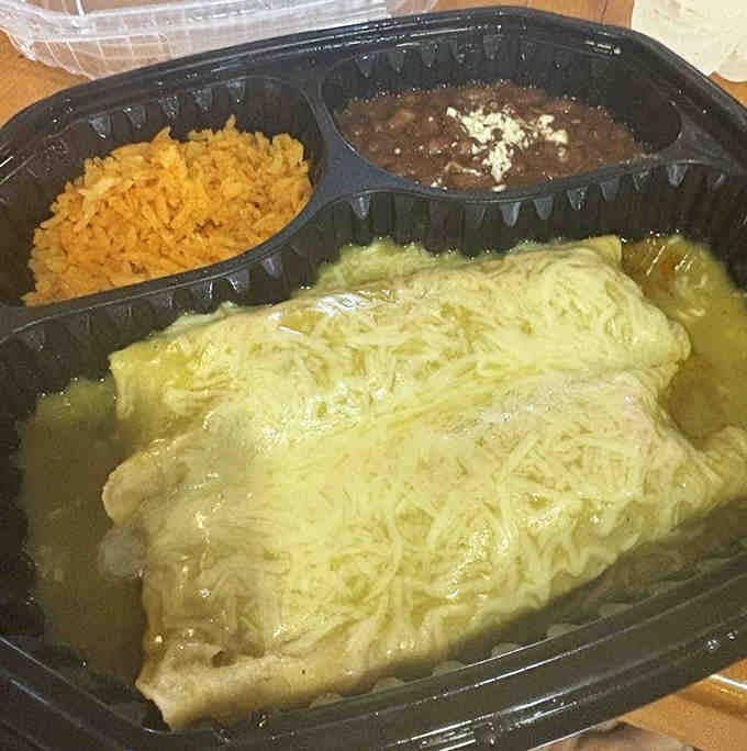 Barbacoa enchiladas with that perfect cheese pull—this is what food dreams are made of, folks.