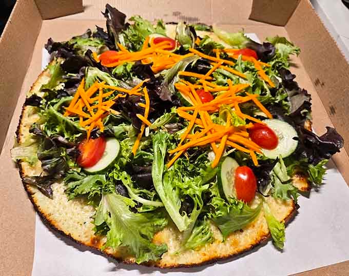 Fresh greens piled high on crispy crust make salad pizza the guilt-free indulgence you didn't know existed.