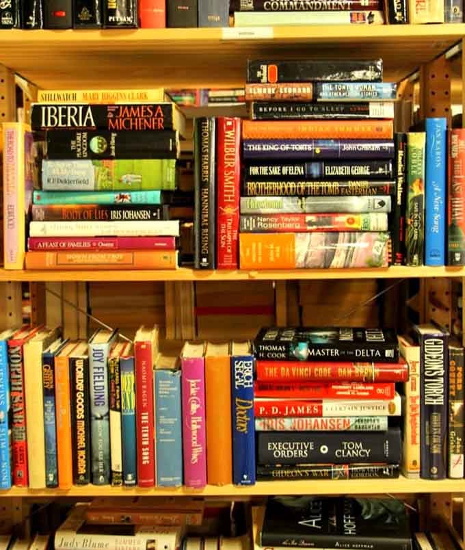 Books stacked on wooden shelves offer literary adventures at prices that would make even libraries jealous of the deals.