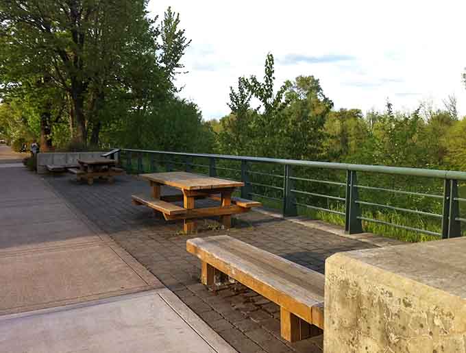 Riverside picnic tables invite you to pause and contemplate life's important questions, like what's for lunch.