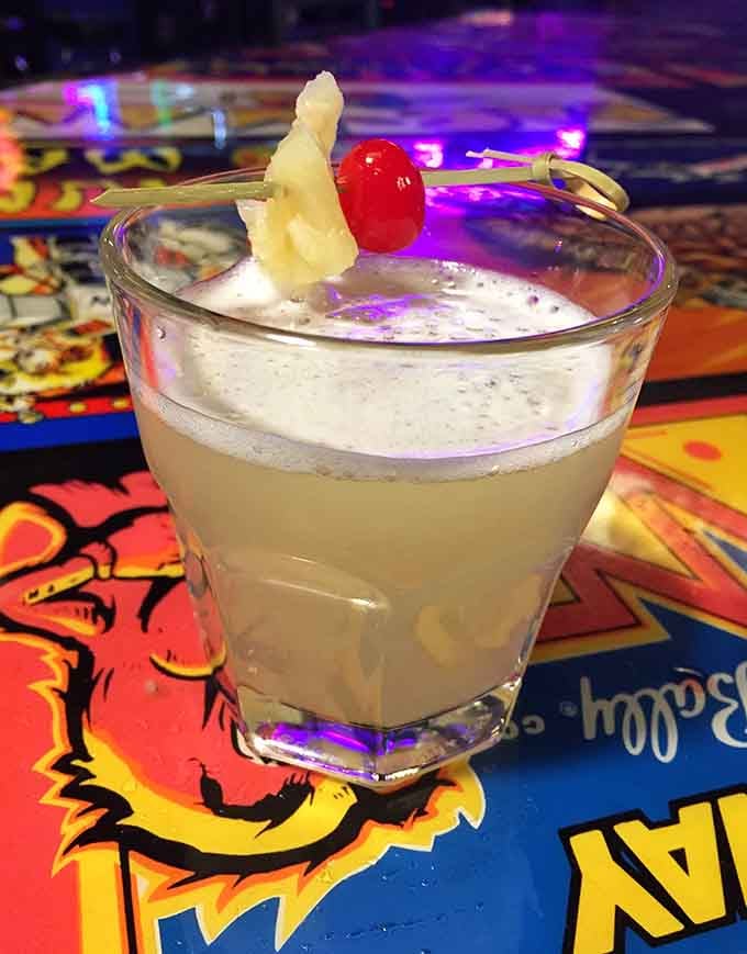 Whiskey sour with a cherry garnish, because even Pac-Man champions need proper refreshment during their championship runs tonight.