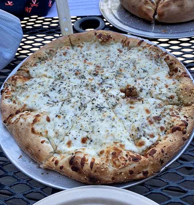 That cheese pull and herb-flecked crust could make a grown person weep tears of pure joy.