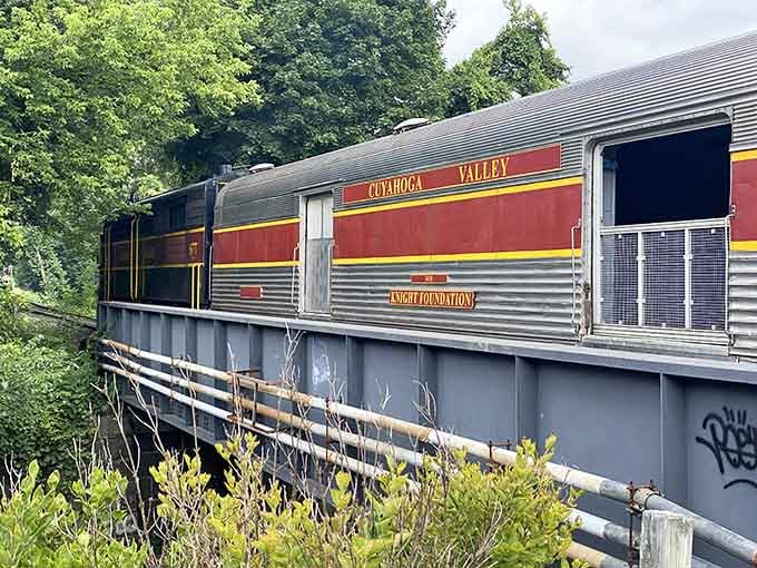 That burgundy and silver railcar stands ready to carry passengers through valleys that Instagram filters can only dream about.